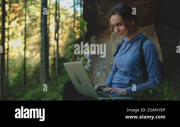 Woman enjoy working in wild nature landscape. Freelance girl typing on ...