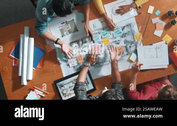 Top view of civil engineer discussing about house construction while ...