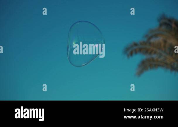 One Soap Bubble Flies in Blue Colour Sky Close up. Happy Playful Person ...