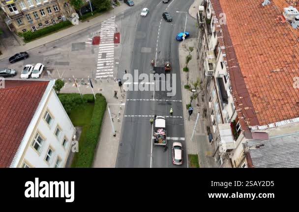 Aerial view of a city street with roadwork in progress, showing ...