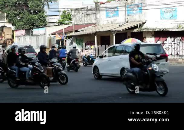 Indonesian intersection without traffic lights, reflecting indiscipline ...