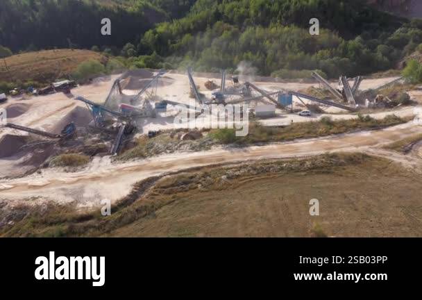Aerial view of stone quarry conveyor belt system in operation, stone ...