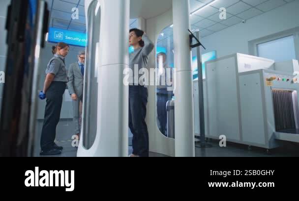 Diverse People Passing Through Metal Detector Gates in Airport Terminal ...
