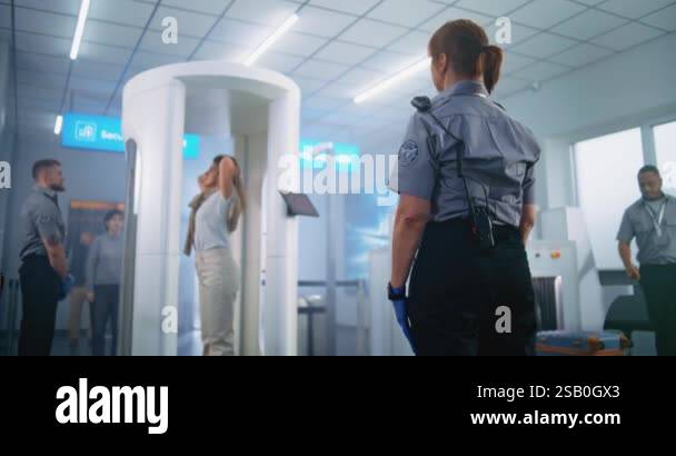Airport Terminal: Woman Passes Through Metal Detector Scanner Gates on ...