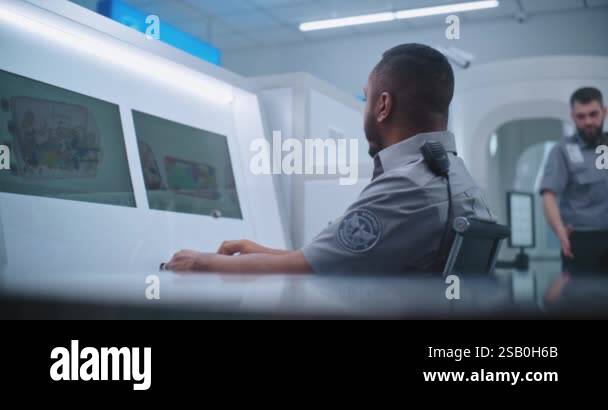Airport Security Checkpoint: African American Security Officer Monitors ...