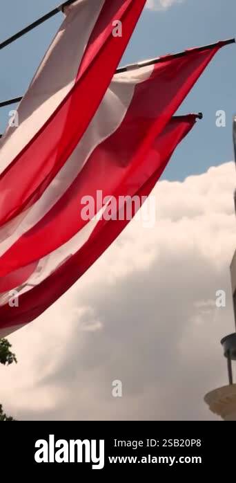 Flag of Monaco waving at wind against beautiful blue sky. High quality ...