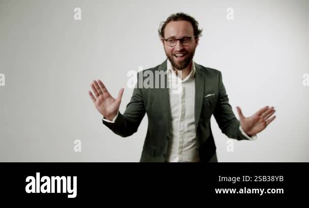 Cheerful businessman extending his arms in welcome, expressing ...