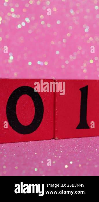 Portrait vertical footage of a red calendar block being placed down ...