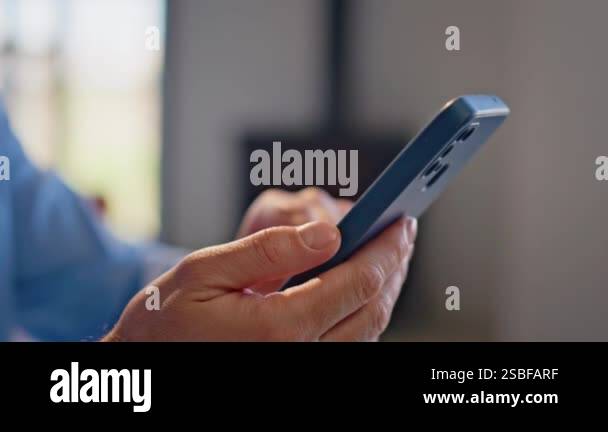 Guy finger swiping cellphone sitting modern office closeup ...