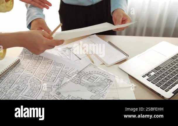 Architect and safety engineer write about construction detail blueprint ...