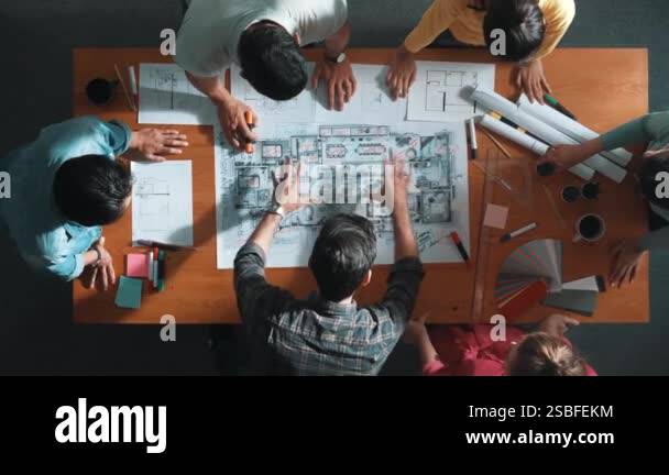 Top down aerial view of designer putting hand together to celebrate ...