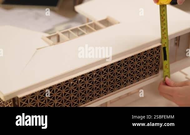 Slow motion home designer using architectural equipment review and ...