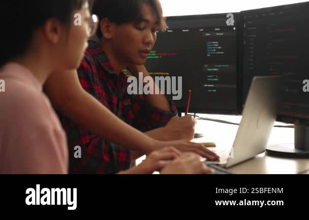 Slow motion back end software developer engineer for computer programming working together on ...