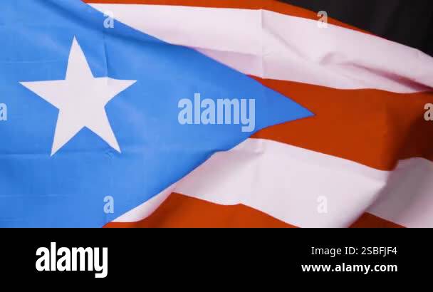 This video showcases the vibrant Puerto Rican flag waving in the wind ...