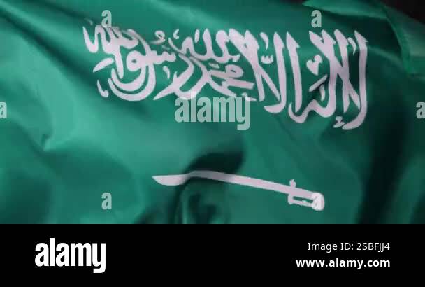 The beautiful flag of Saudi Arabia is gracefully waving in the wind ...