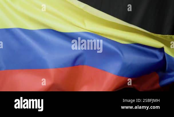 This video highlights the vibrant Colombian flag waving in the wind ...