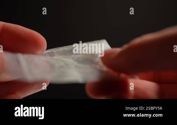 Hand of the drug dealer show off and lure with prescription opioid pill ...