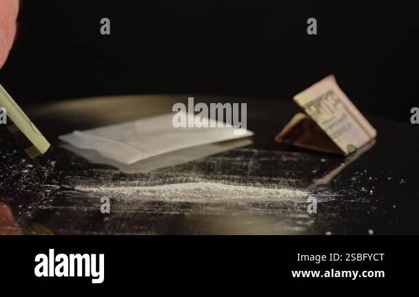 Crushed to powder prescription opioid oxy pills drugs spilled at table ...