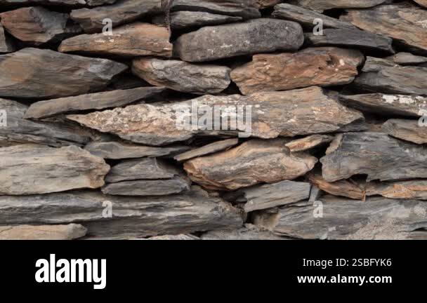 An intricately designed arrangement of flat, layered slate stones that ...