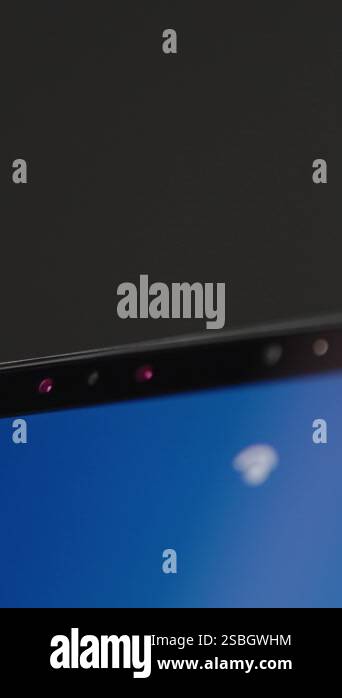 Vertical video. Close-Up of Laptop Camera Infrared Sensors Blinking Red ...