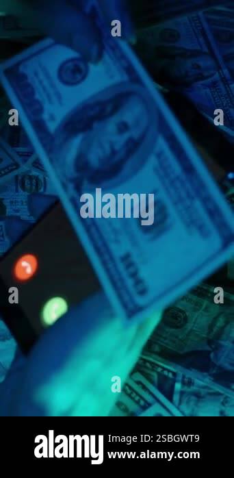 Vertical video. A smartphone displaying an incoming scam call alert is ...