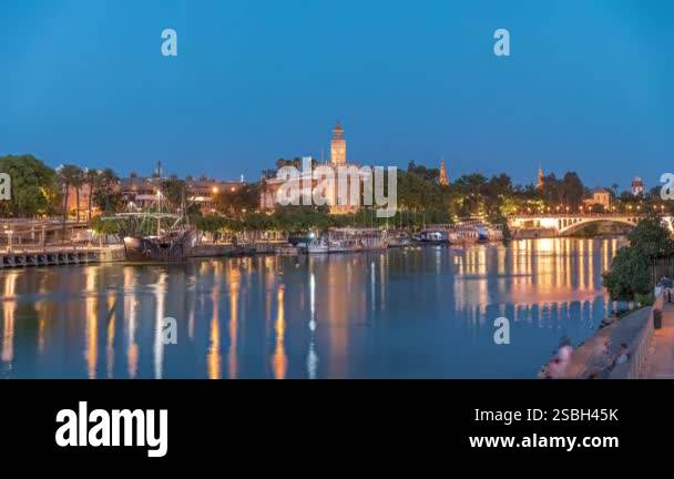 Torre del Oro watchtower in Seville, Spain. Day to night transition ...