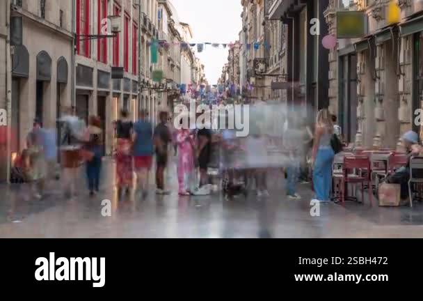 Tourists and locals walking and shopping in Rue Sainte-Catherine ...