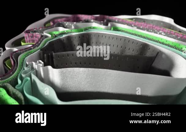 Breathable layers of colorful, perforated fabrics creating a wavy ...