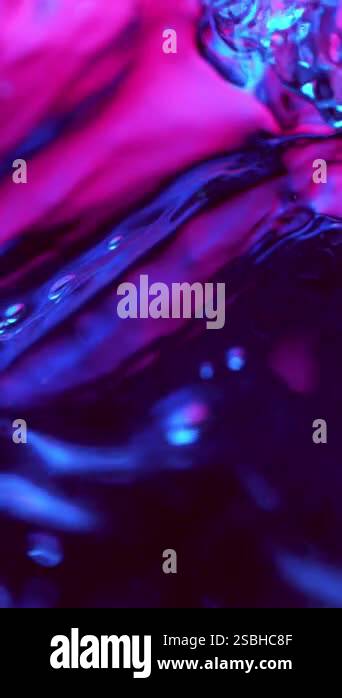 Super Slow Motion of Splashing Water Waves Illuminated by Neon Lights ...
