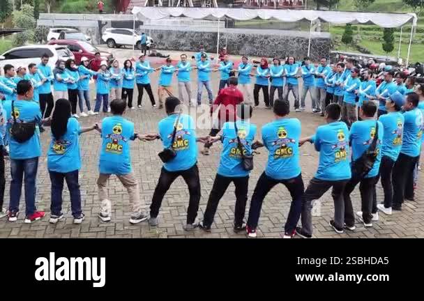 Group of people are playing team working Game to build a teamwork ...