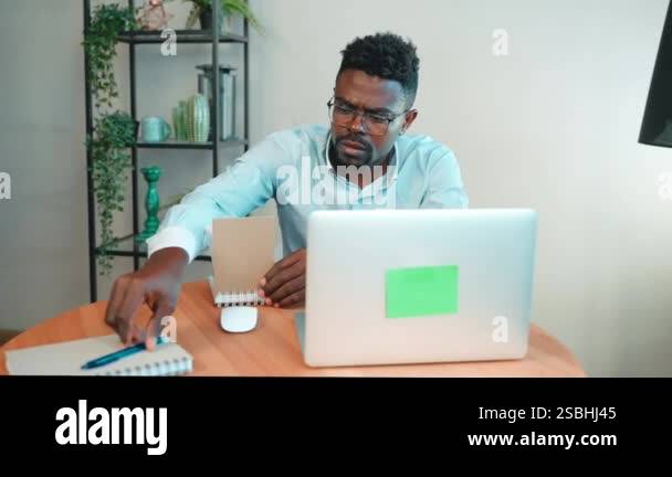 businessman working with laptop, portrait, African American man looking ...
