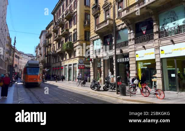 The vintage housing, crowded walkways and vintage trams on Via Torino ...