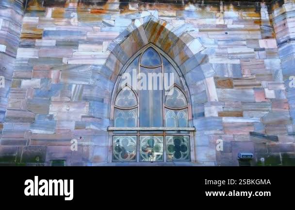 Panorama of the wall with windows, carvings and sculptures of ...