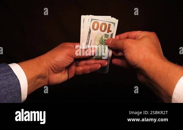 Two hands count $1,000 in $100 bills using the manual "bill flipping ...