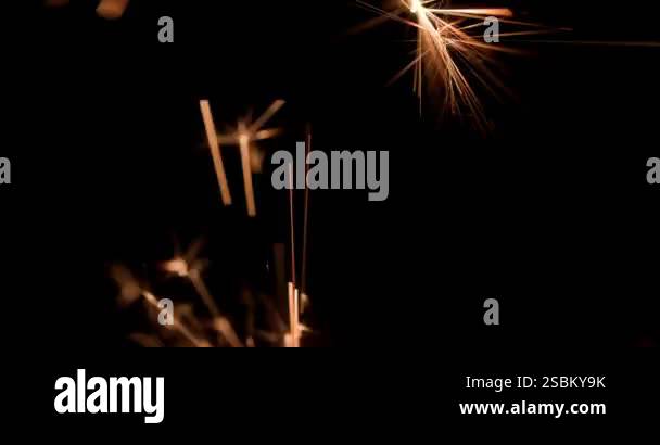 lovely fireworks spreading sparkles away in the dark and black sky ...