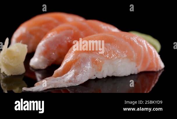 perfectly served uncooked meal, fresh nigiri sushi with raw pink salmon ...