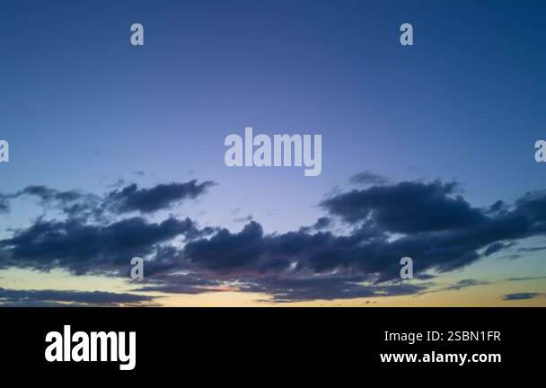 Sky time lapse. Moving clouds at sunset. Clouds float through the ...