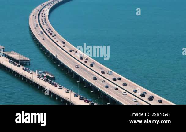 Highway road traffic driving over Sunshine Skyway Bridge in Florida ...