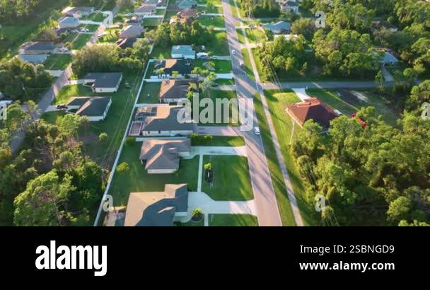 View from above of suburban street traffic with driving cars in ...