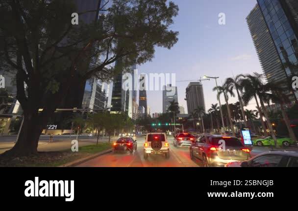 Car driving at nighttime around Miami downtown district on American ...