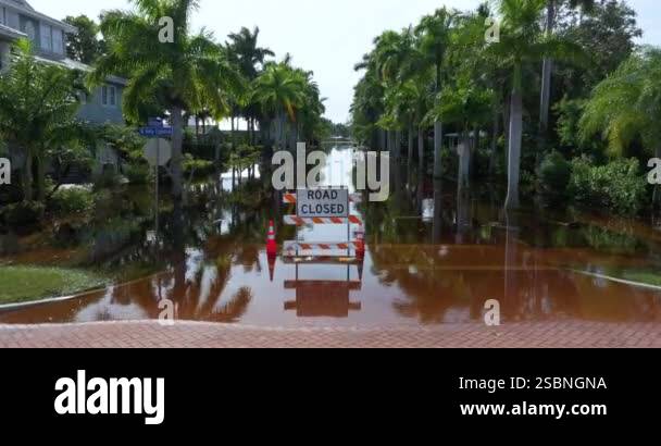 Road under water warning sign. City street closed because of flooding ...