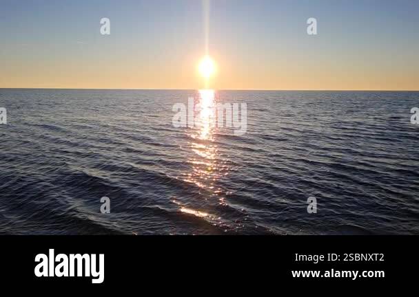 sea waves and sun on the horizon Stock Video Footage - Alamy