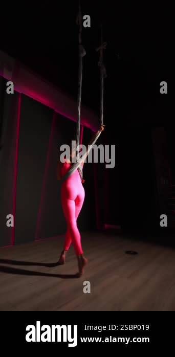 woman performing aerial dance with pylon in gym Stock Video Footage - Alamy