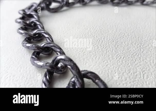 Black metal chain on a white background. Bold experiments in fashion. A ...