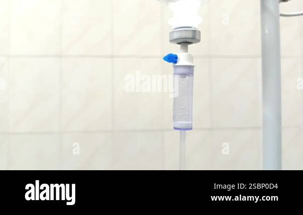 A hospital IV drip in close-up, with a place for text on the side. The ...
