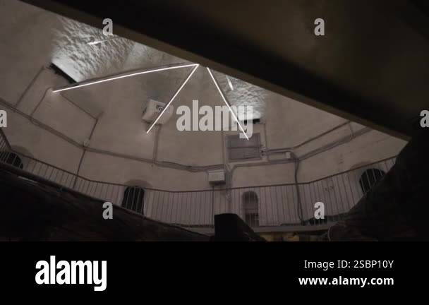 Conical roof of museum room supported by system of iron supports ...