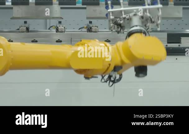 Demo yellow robotic arm with vacuum suction cups operates in front of a ...