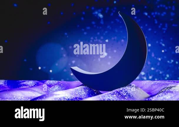 Glimmering particles falling around a stylized crescent moon resting on ...