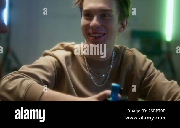 Rack focus of Caucasian gen z boy in street style clothes with hip hop ...