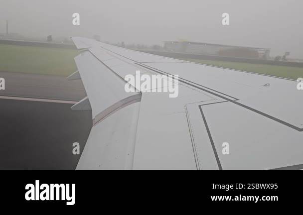 Airplane taking off in heavy fog. A view from inside an airplane ...